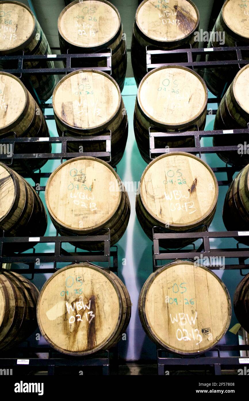 Beer aging in wooden oak barrels casks on rack in warehouse at River ...