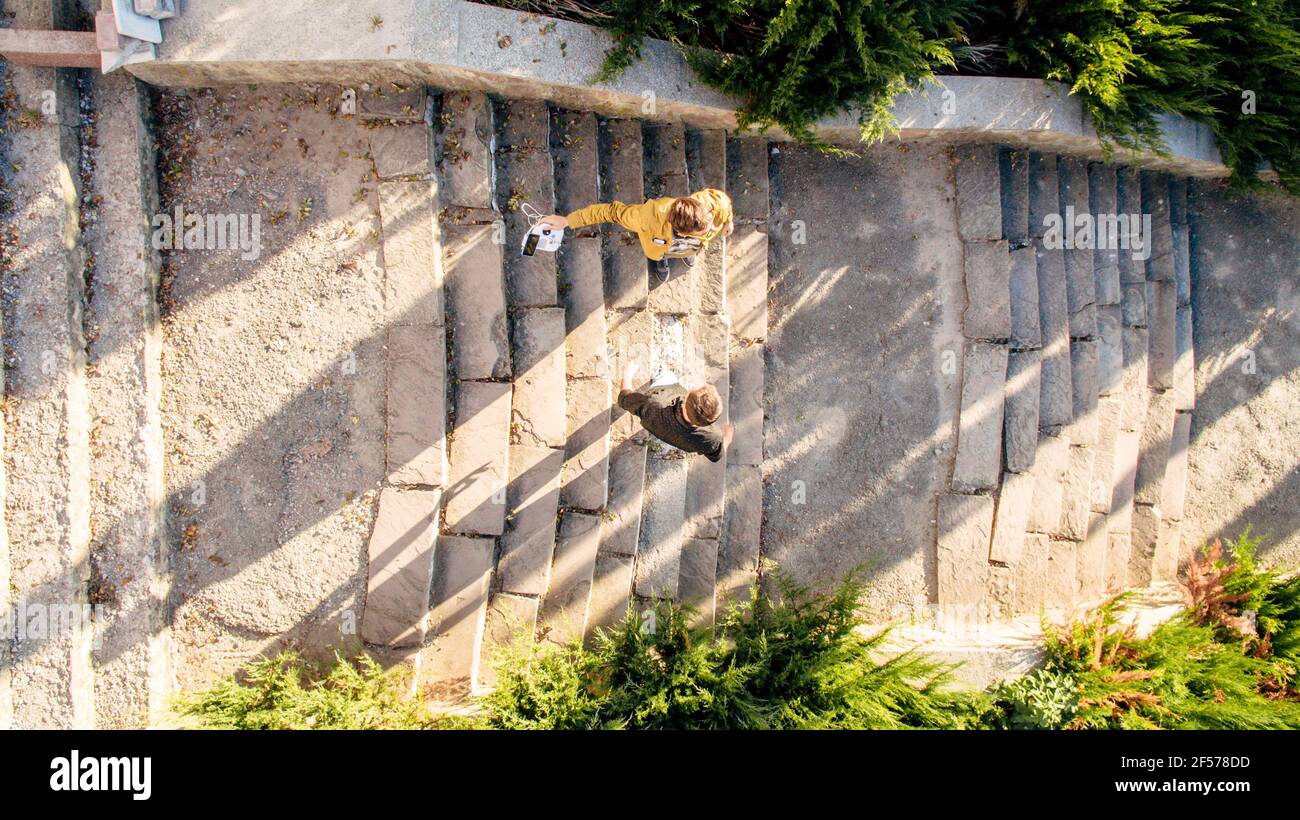 Two guys are standing on the steps. View from above Stock Photo - Alamy
