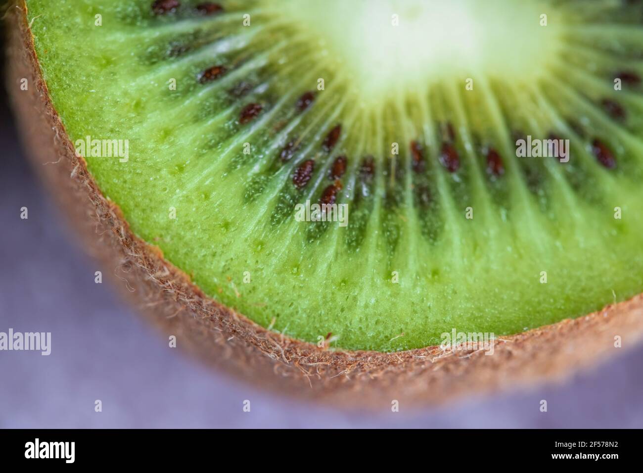 Close-up on the texture of cut fruit kiwi top view Stock Photo - Alamy