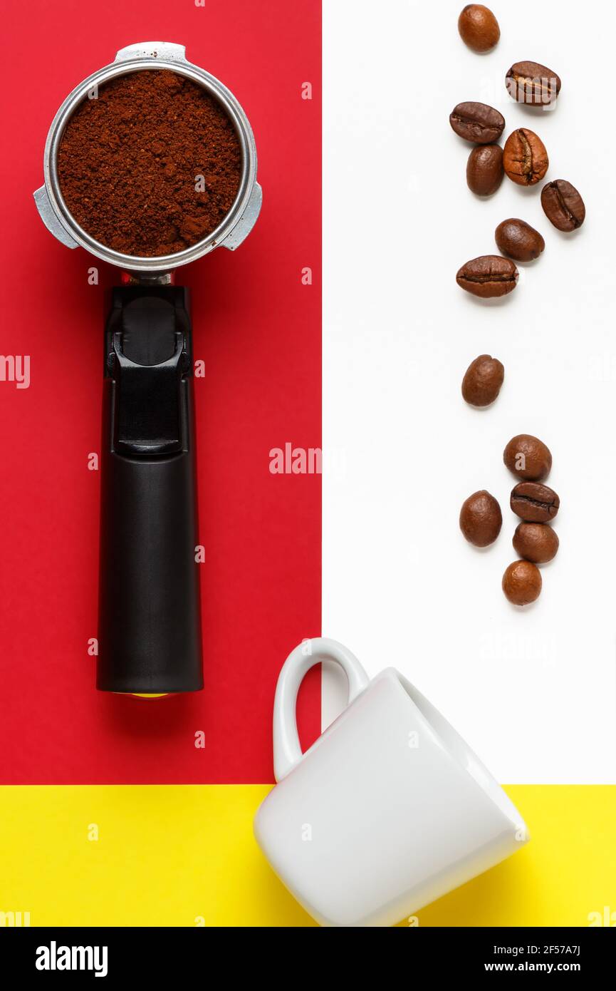 Espresso machine filter holder with ground coffee, coffee beans and ...