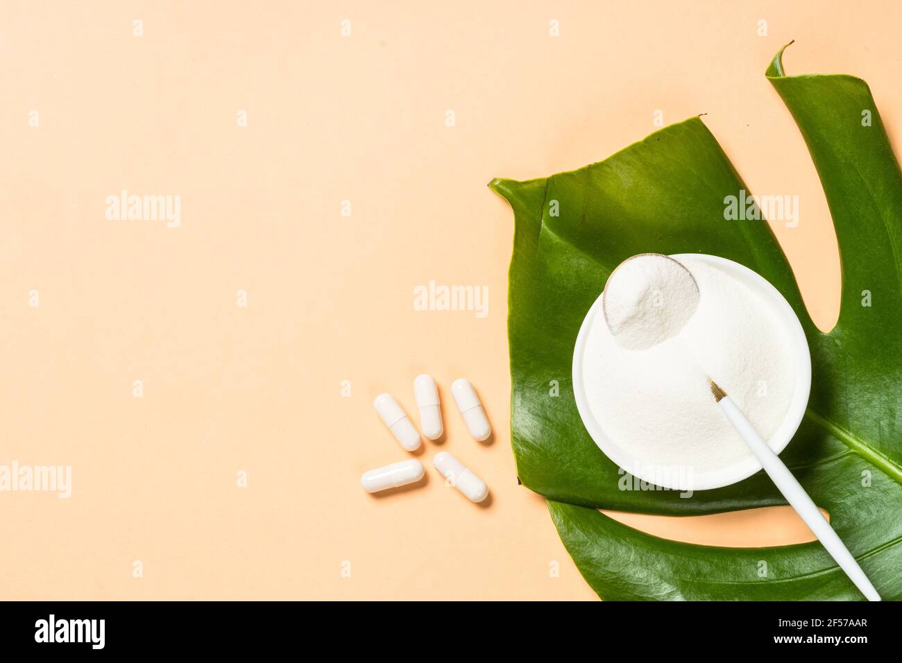 Collagen powder dietary supplement at blue Stock Photo - Alamy