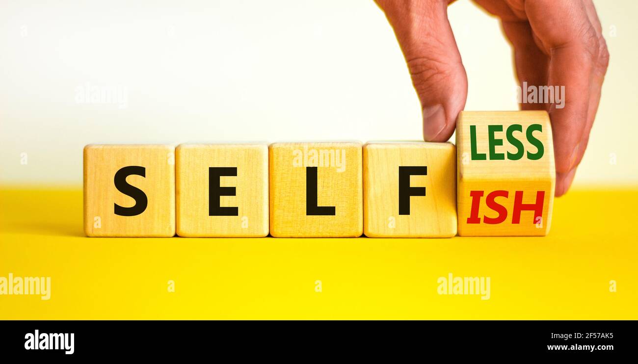 Selfish or selfless symbol. Businessman turns cubes and changes the ...