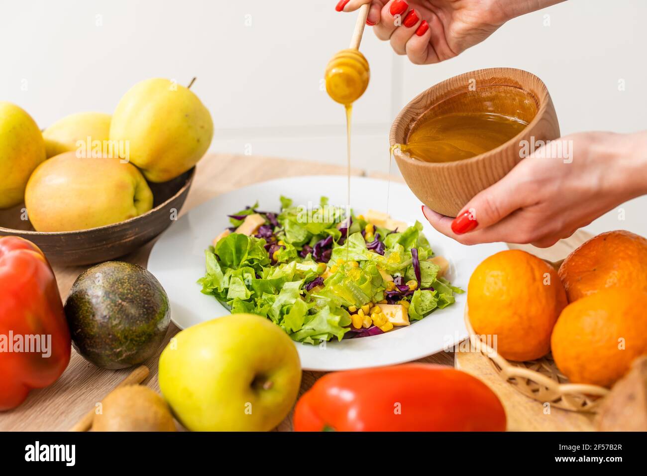 Hand adding mustard salad hi-res stock photography and images - Alamy