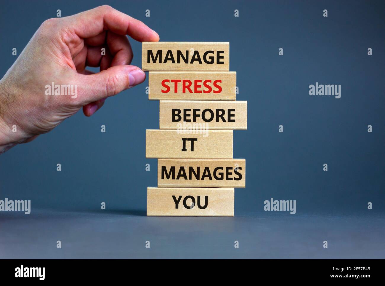 Stress management symbol. Wooden blocks with words manage stress before ...