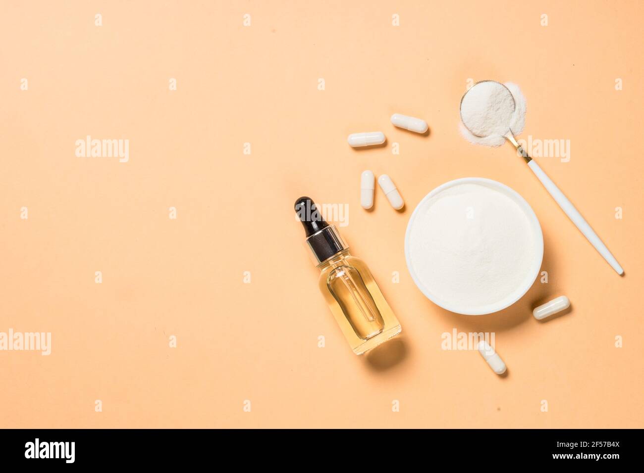 Collagen powder dietary supplement at pastel background Stock Photo - Alamy