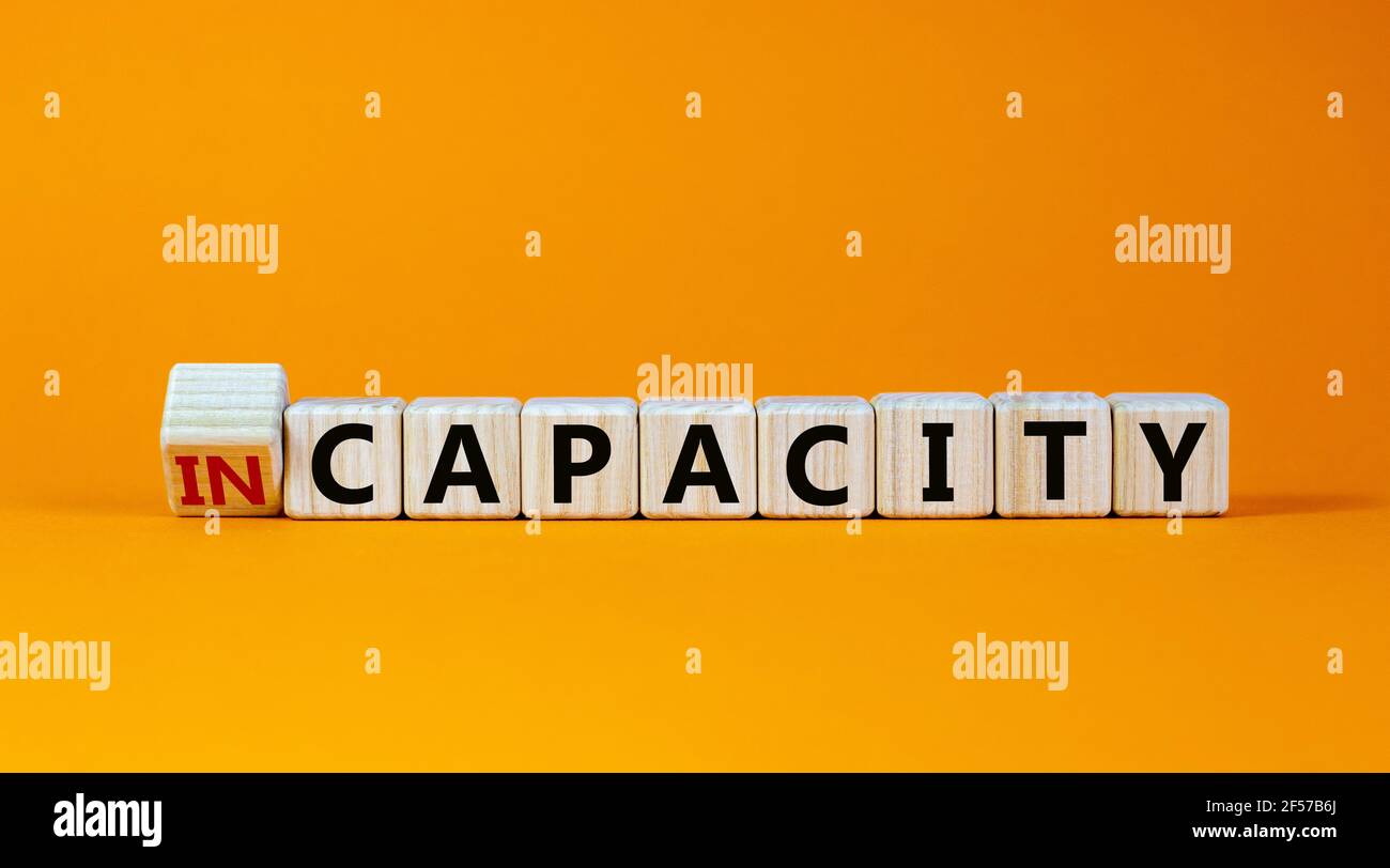 Capacity or incapacity symbol. Turned a wooden cube and changed the ...