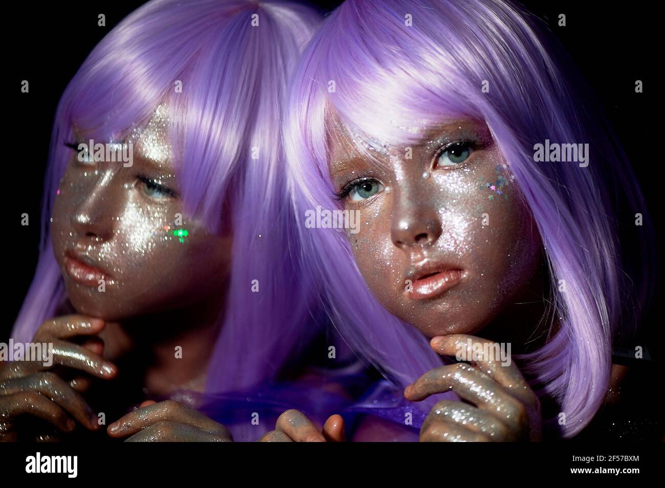 A girl with purple hair and glowing skin. An alien or a fairy with ...