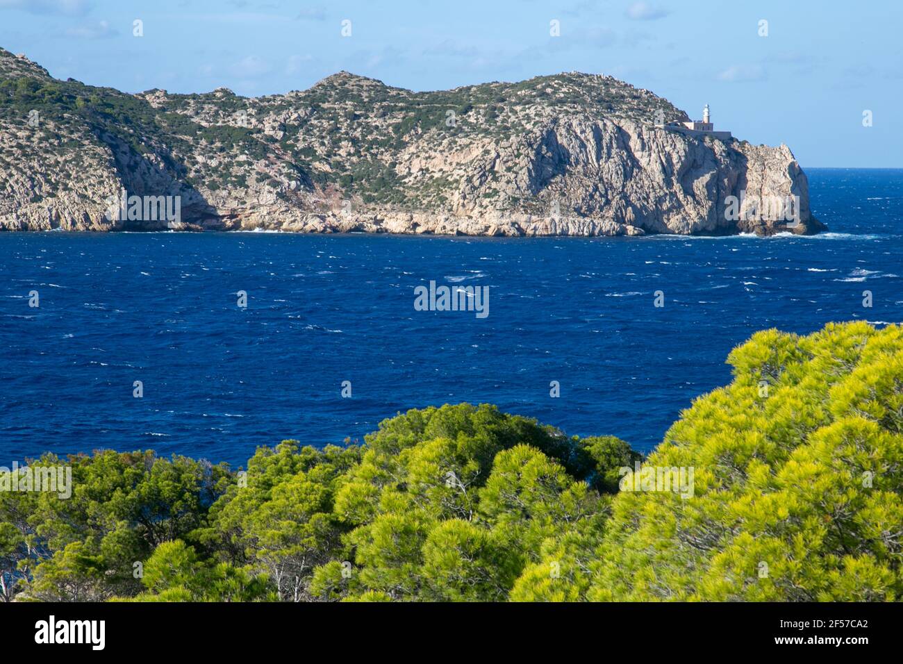 Sa Dragonera Island with a lighthouse seen from Mallorca Stock Photo ...
