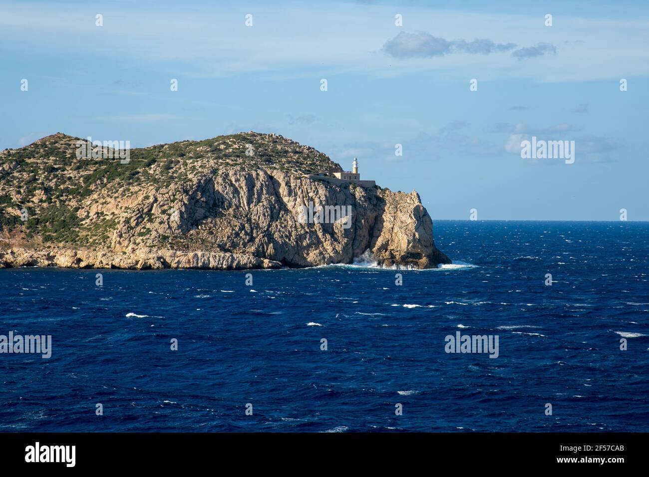 Sa Dragonera Island with a lighthouse seen from Mallorca Stock Photo ...