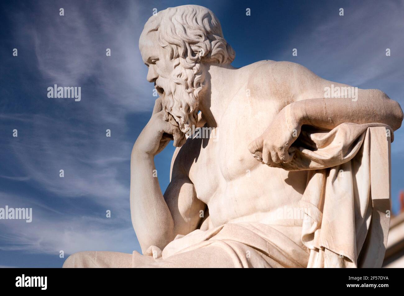 classic statue of greek philosopher Socrates close up under blue sky ...
