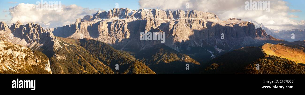 Evening view of Sella gruppe or gruppo di Sella with clouds and Selva ...
