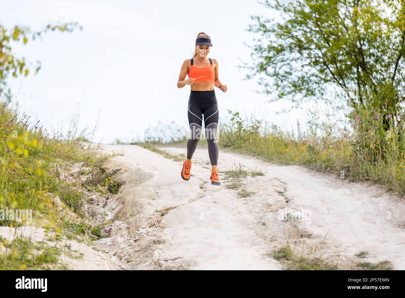 Female runner on country road hi-res stock photography and images - Alamy