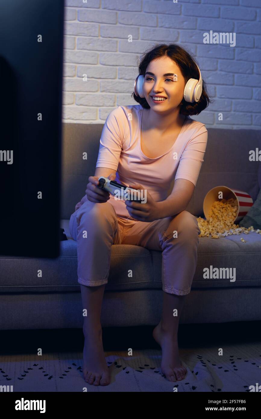 involved gamer girl playing video games on the console Stock Photo - Alamy