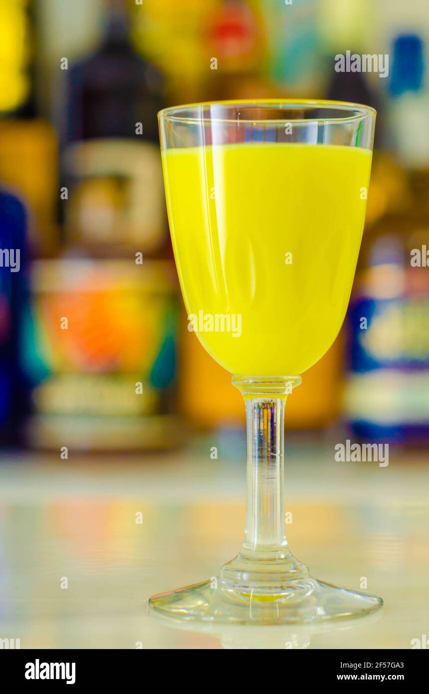 Egg liqueur in shot glass prepared by the bartender on the background ...