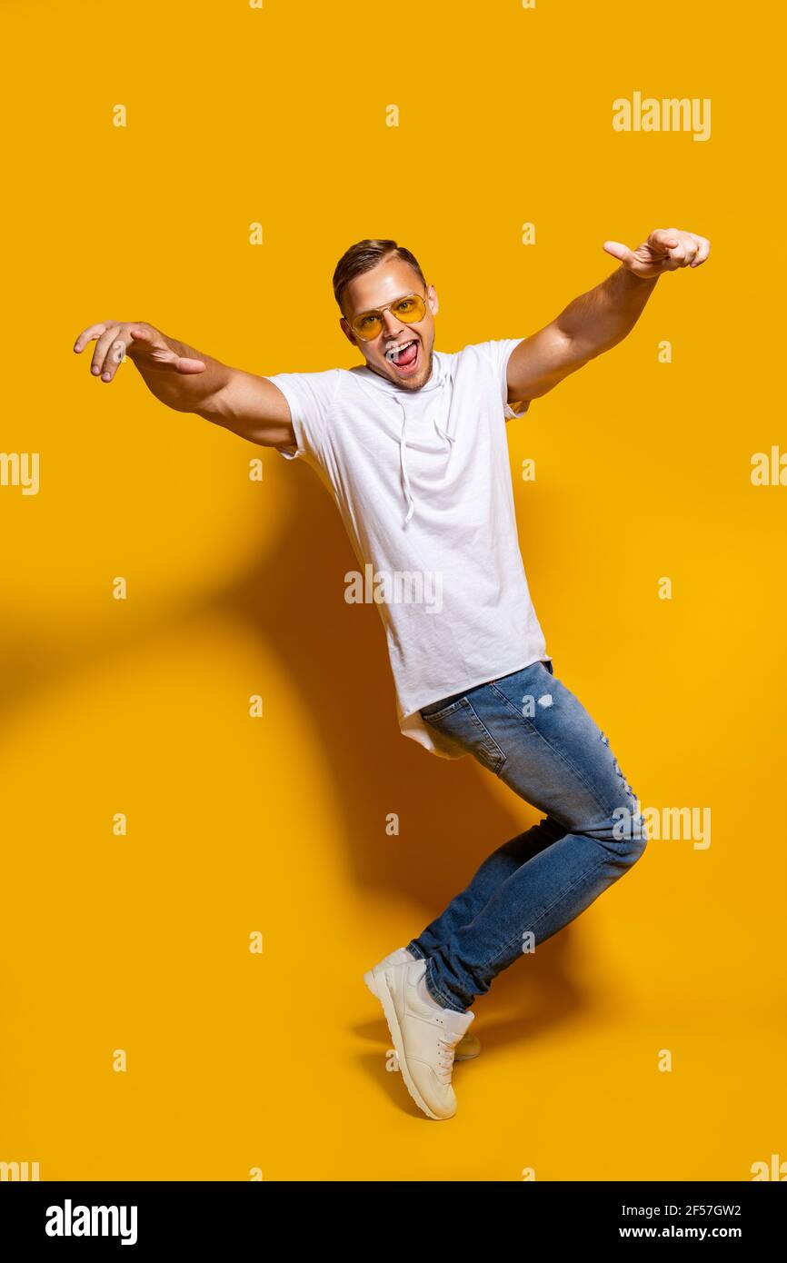 Stylish guy pointing at camera on yellow isolate Stock Photo - Alamy