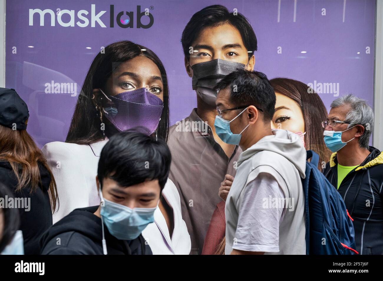 Pedestrians wearing facemasks as a preventive measure against the ...