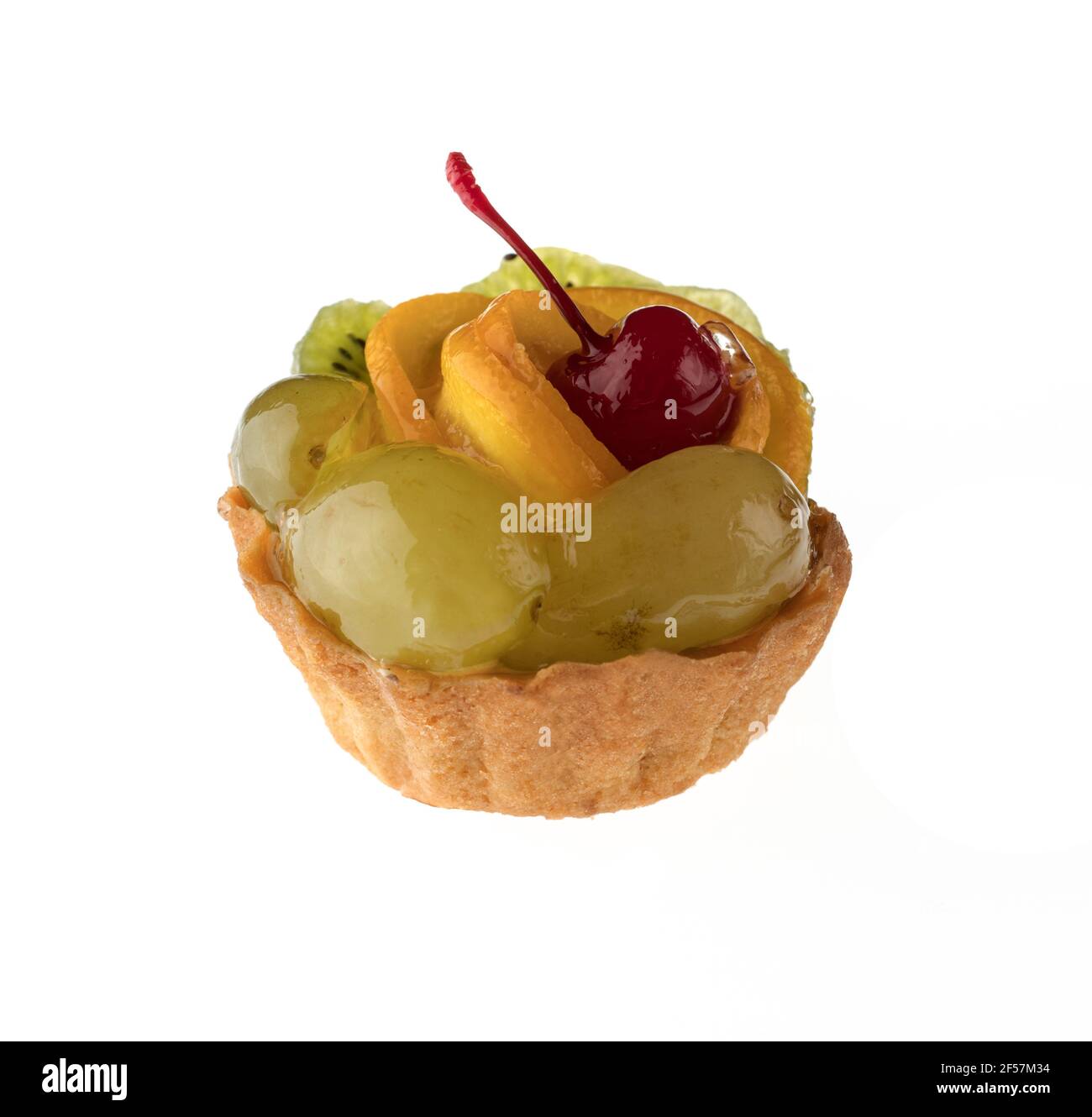 Dessert, fruit cake, with cherry grapes and orange slices, on a white ...