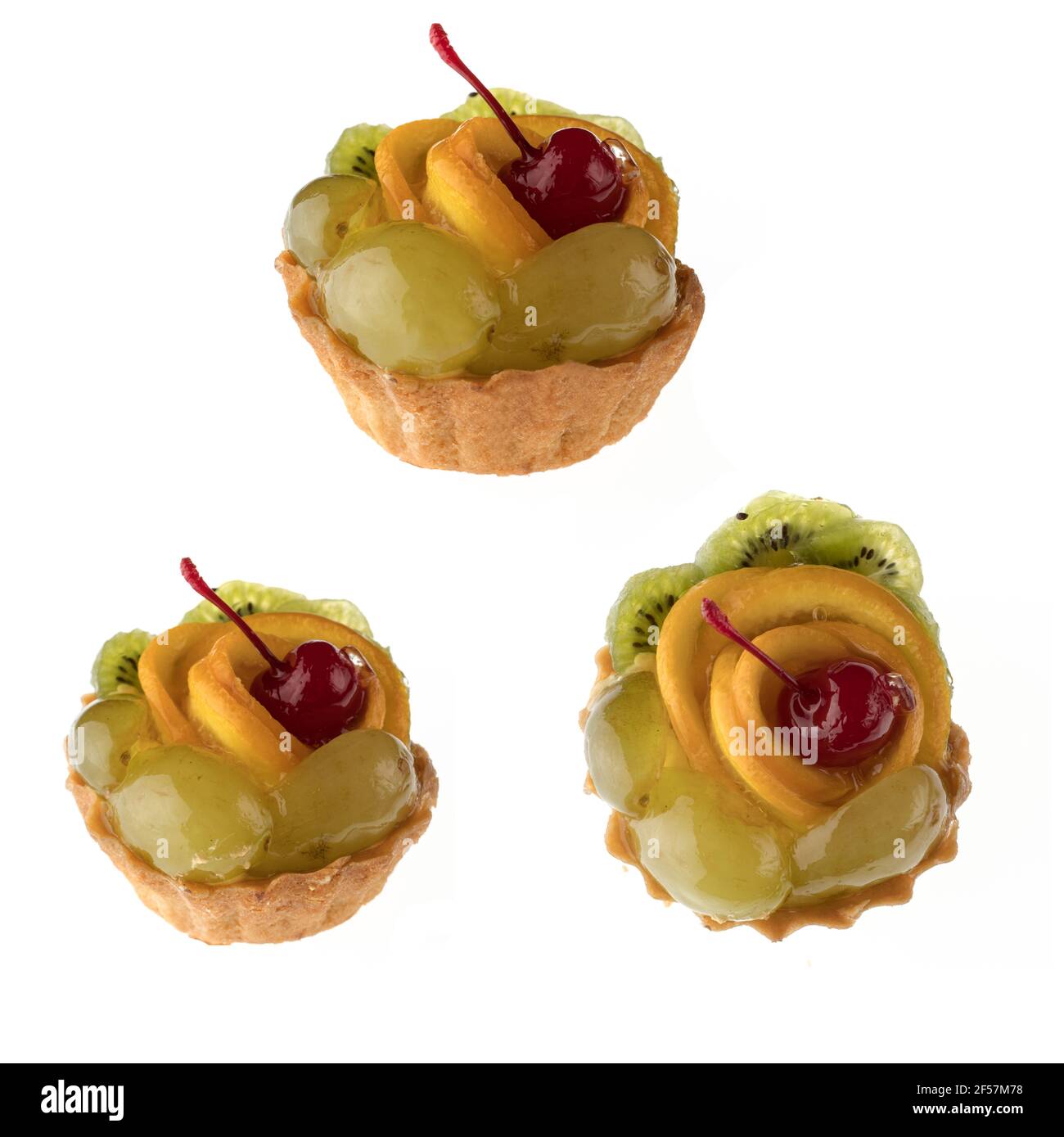 Dessert, fruit cake, with cherry grapes and orange slices, on a white ...