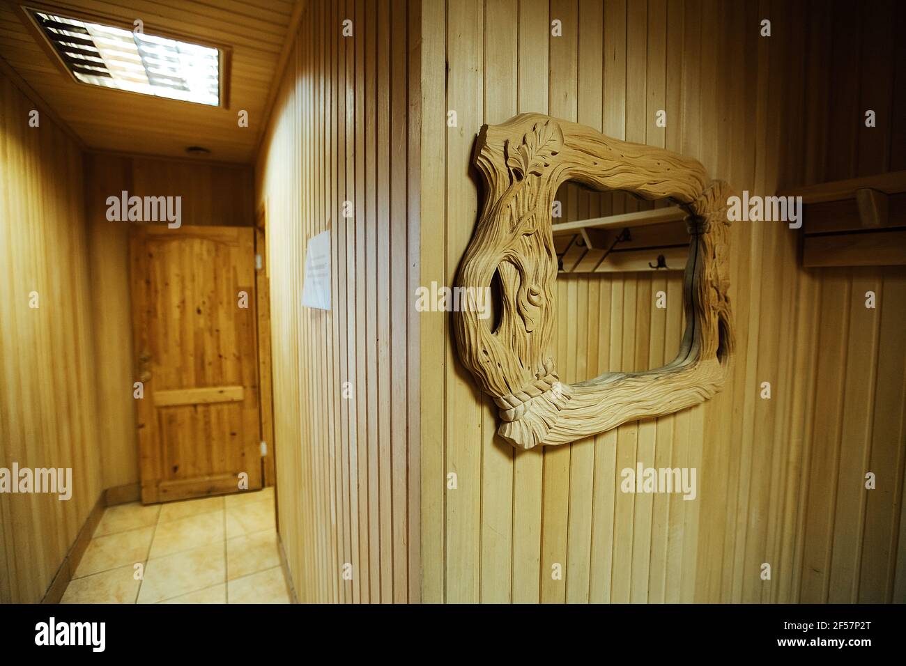 wooden table and chairs in the sauna. dressing room and steam room for ...