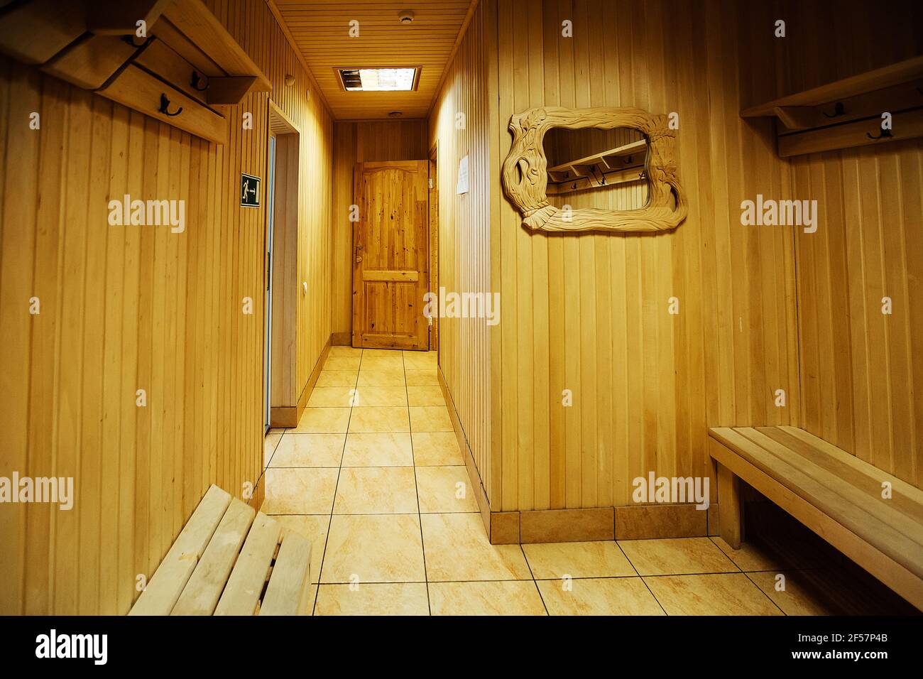 wooden table and chairs in the sauna. dressing room and steam room for ...