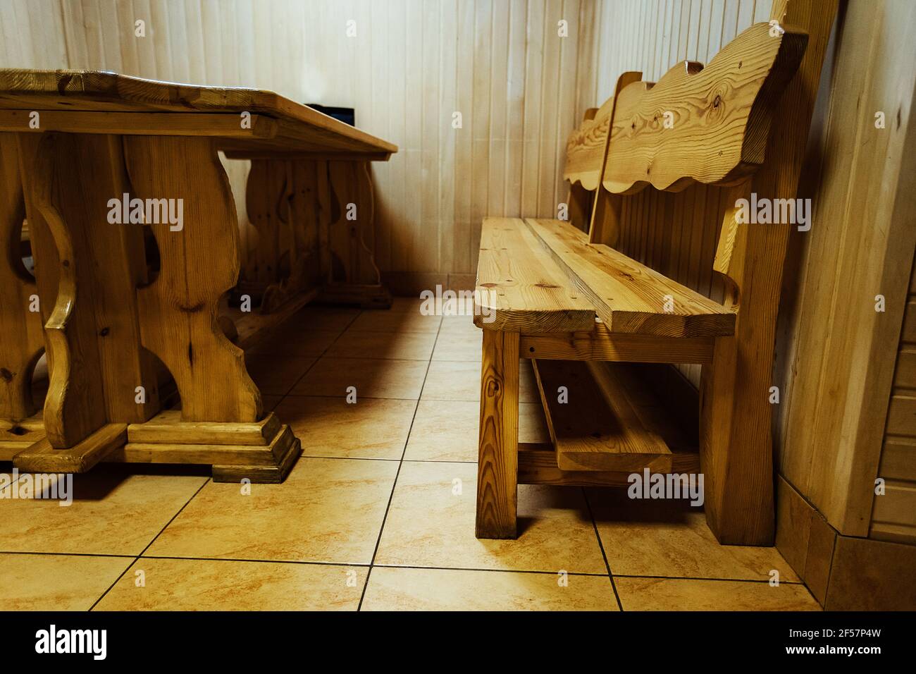 wooden table and chairs in the sauna. dressing room and steam room for ...