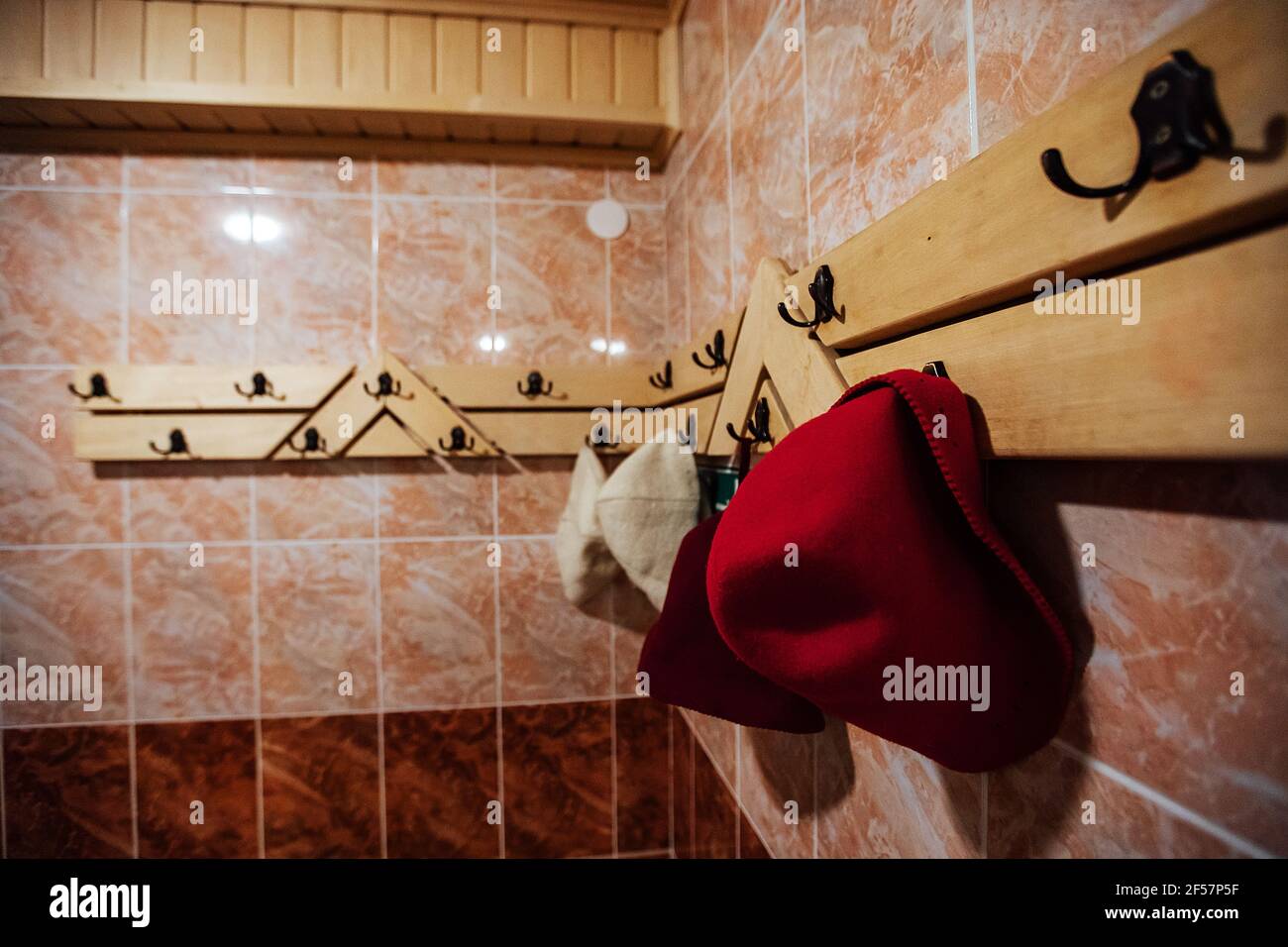 wooden table and chairs in the sauna. dressing room and steam room for ...
