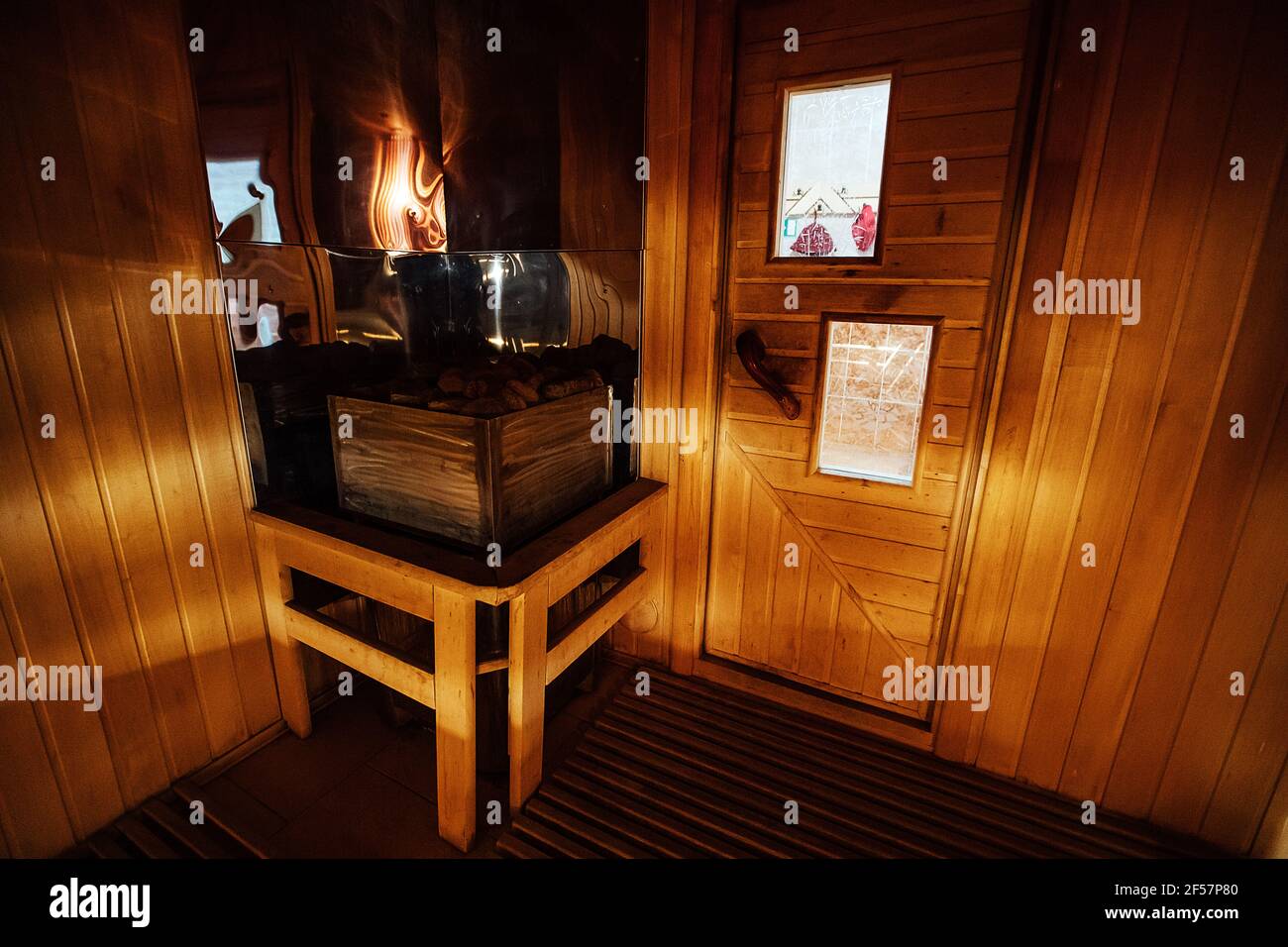 wooden table and chairs in the sauna. dressing room and steam room for ...