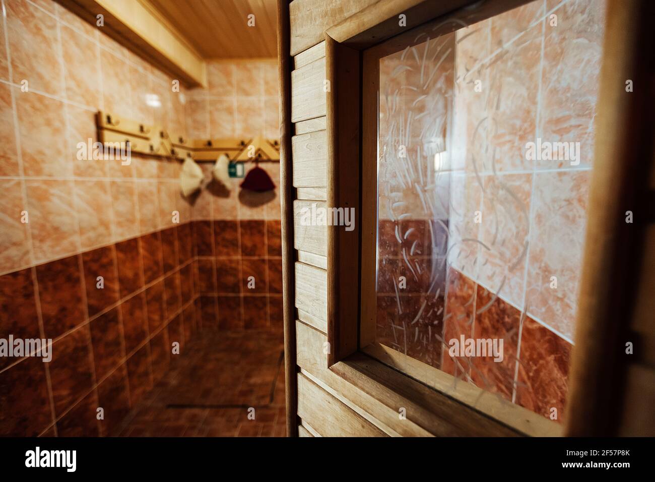 wooden table and chairs in the sauna. dressing room and steam room for ...