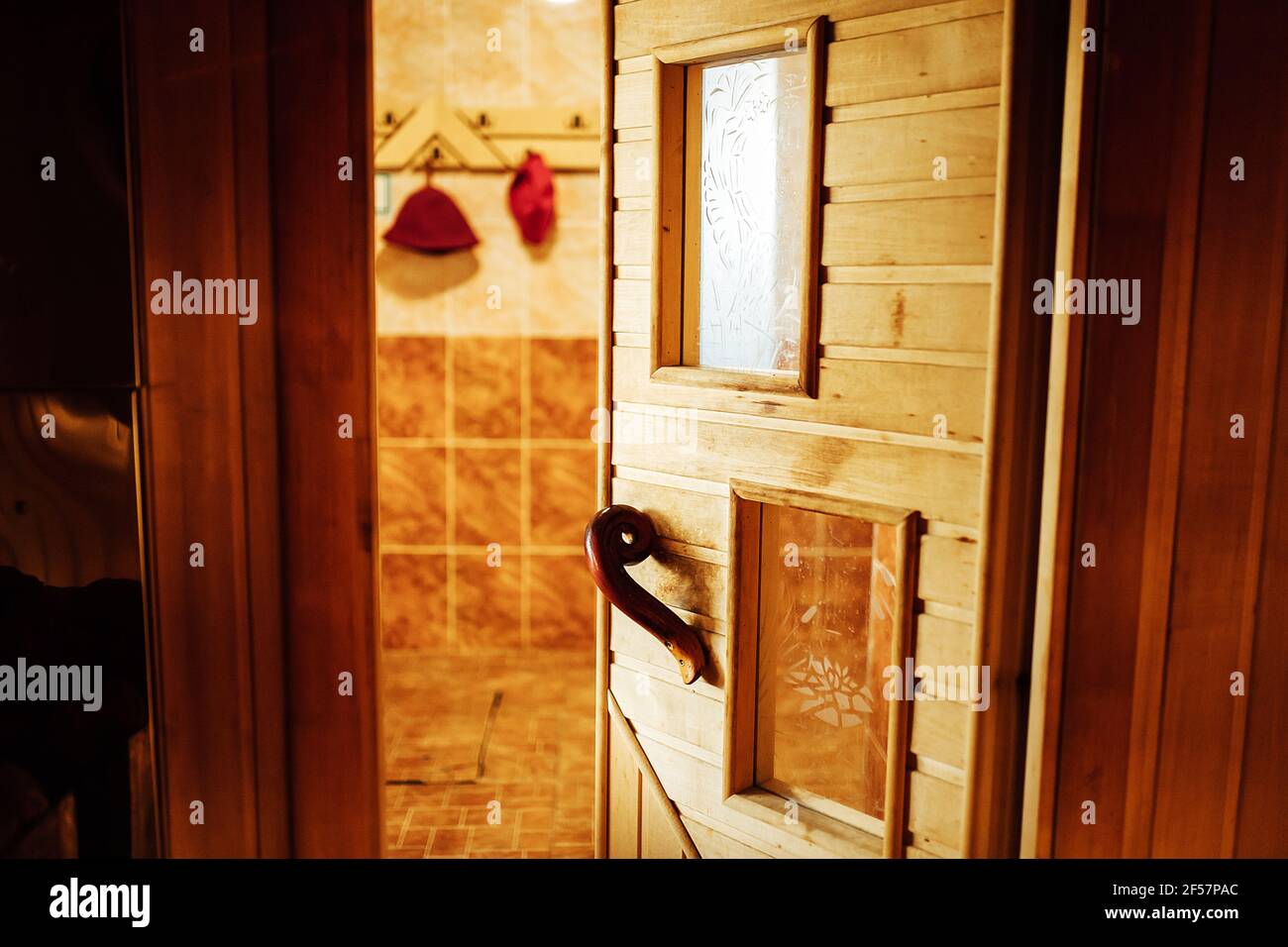 wooden table and chairs in the sauna. dressing room and steam room for ...