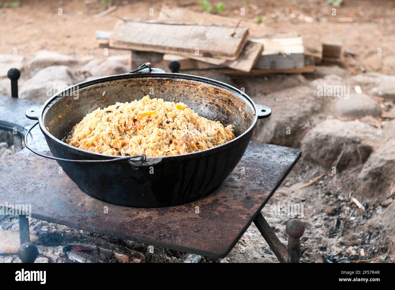 Large cooking pot with finished pilaff, rice, carrot and mutton meat ...