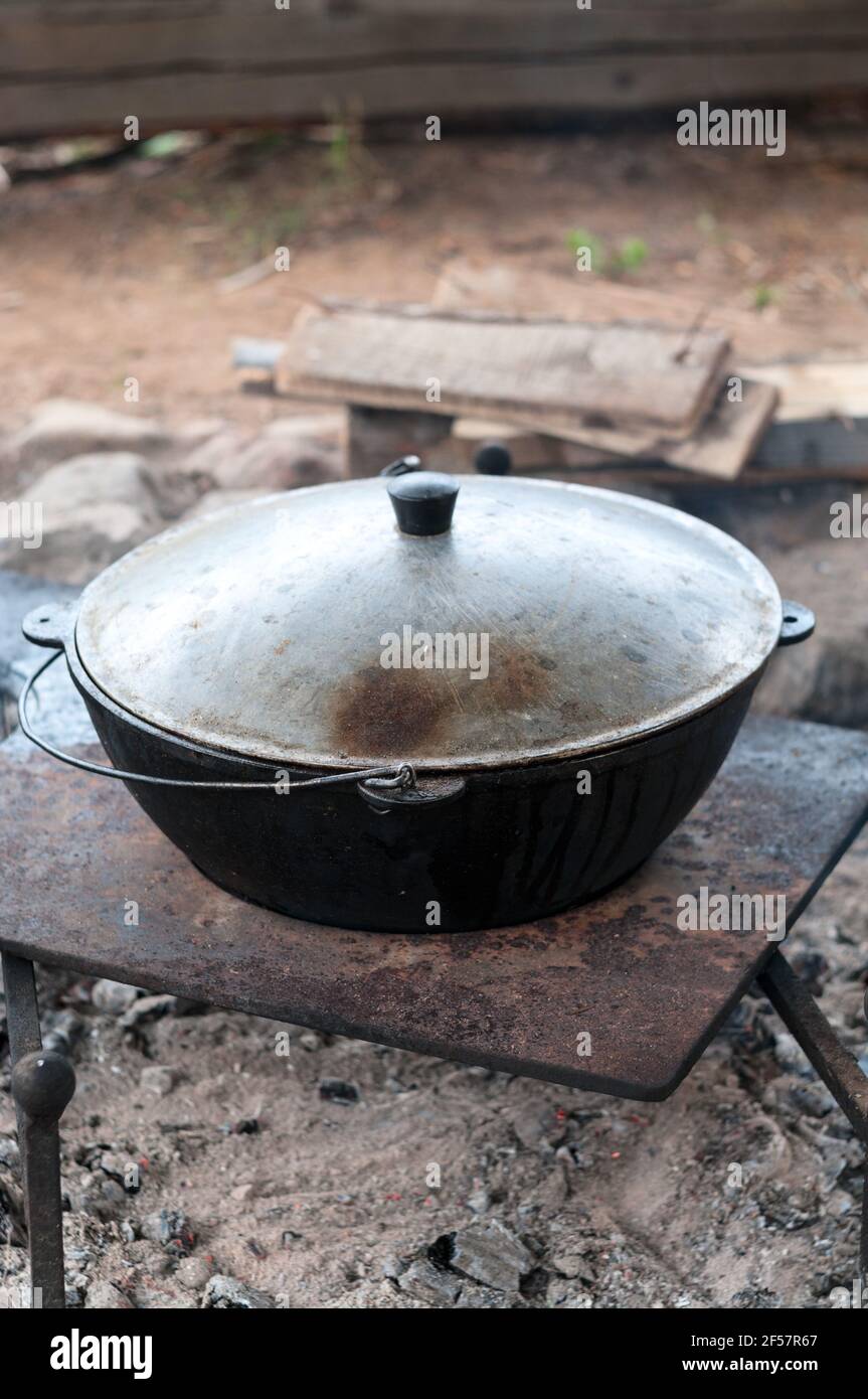 Cauldron is covered by a lid for pilaff cooking. Rice pilaf cooking ...