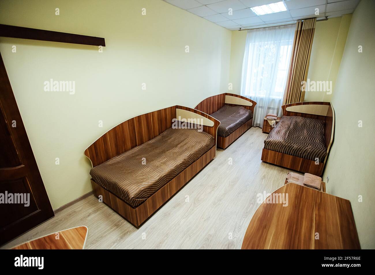 a room in a cheap hotel. minimalistic interior of an economy class ...