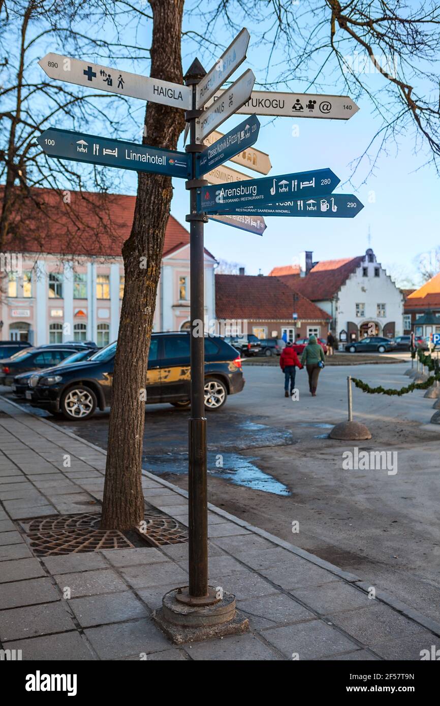 Direction sign is in center of town, between historical buildings. Ways ...