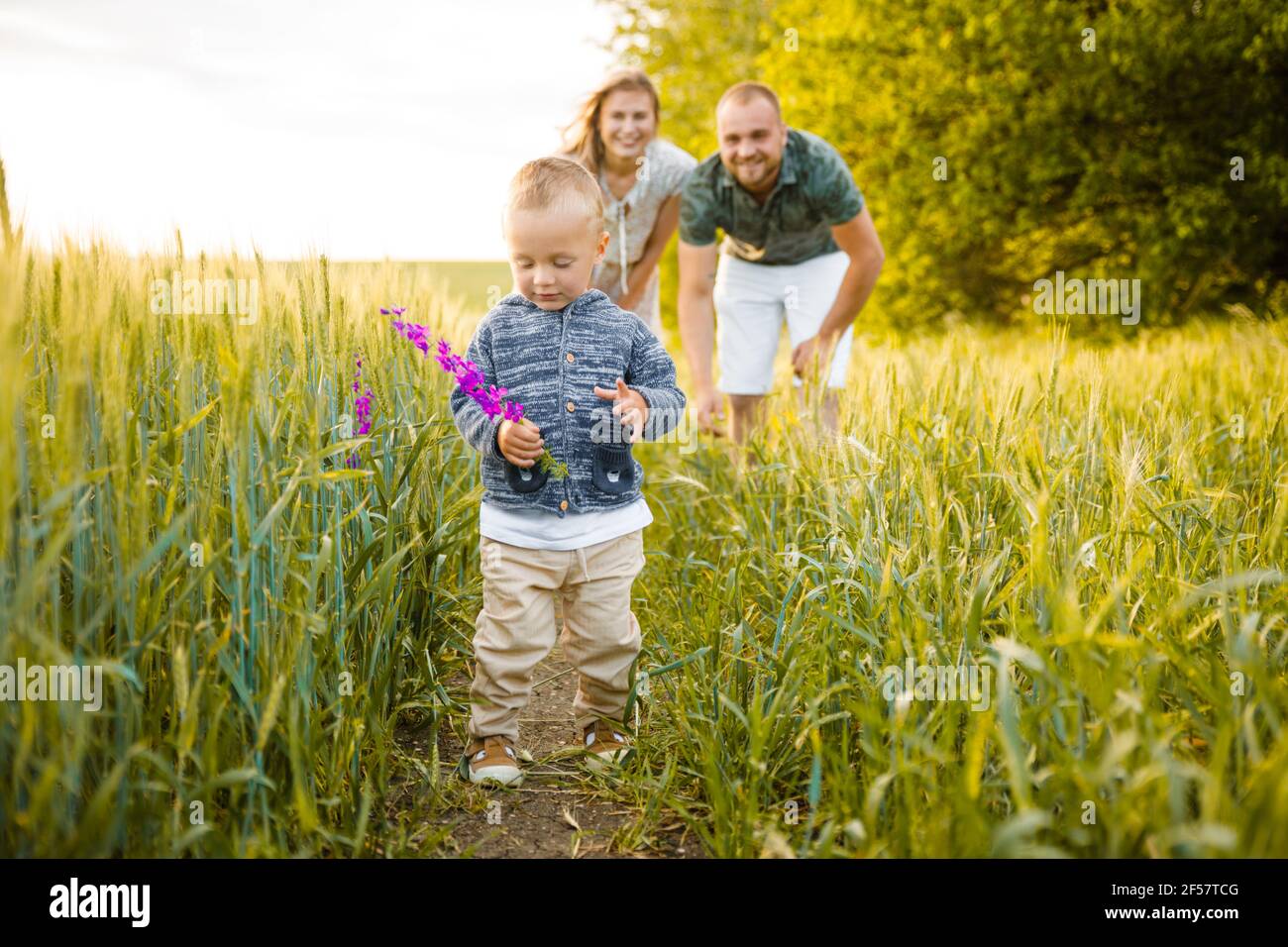 Happy family in nature. Mother, father and son in nature Stock Photo ...