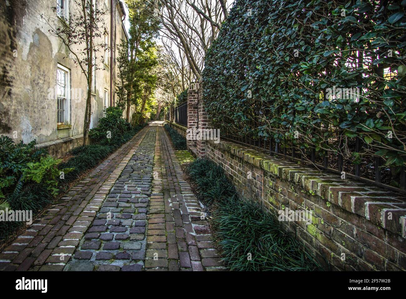 Narrow brick lined hidden and secret historic alley way in downtown ...