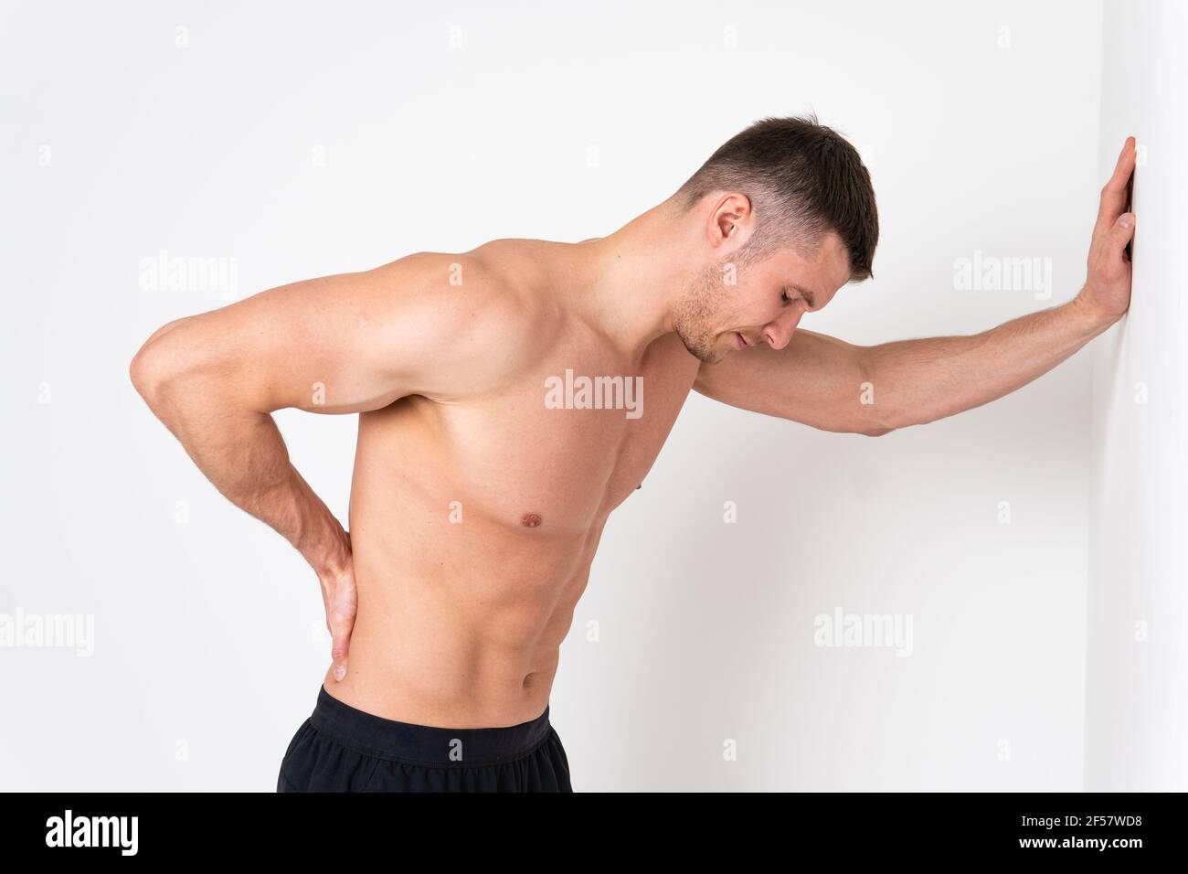 A man back pain keeps his hand on his back back painful, backache ...