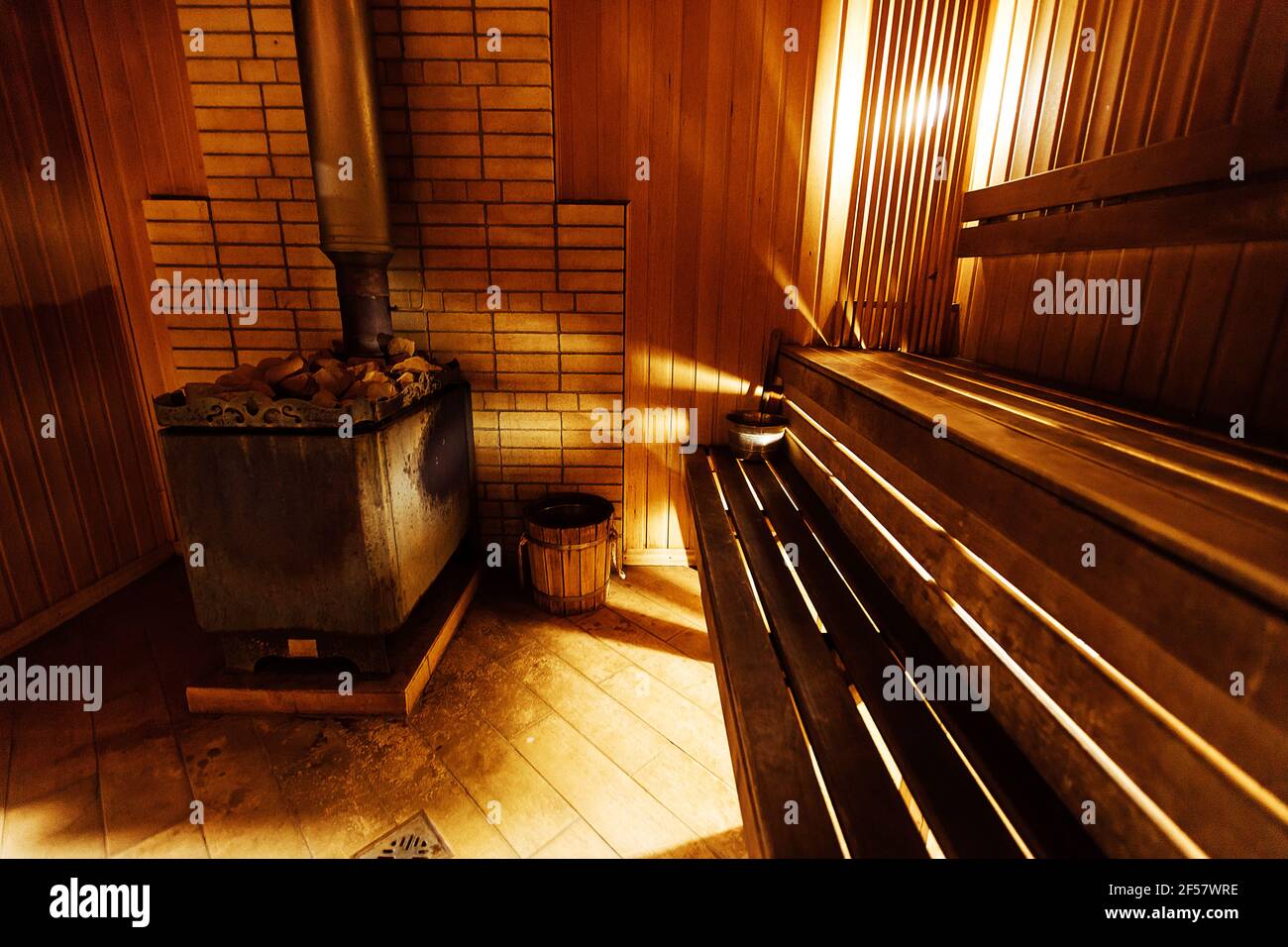 wooden table and chairs in the sauna. dressing room and steam room for ...