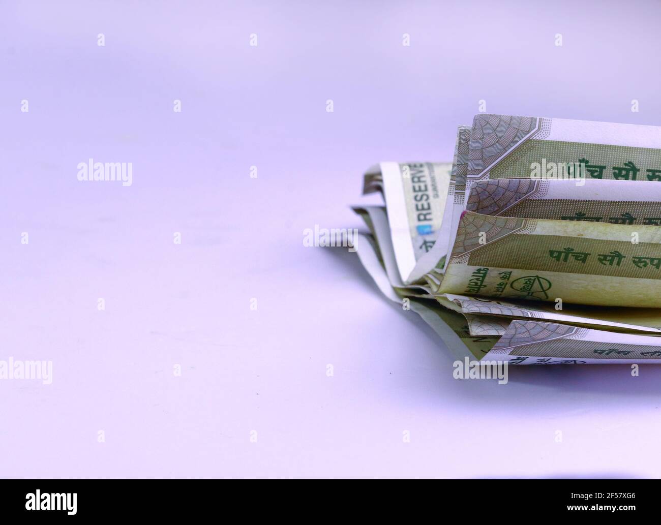 Indian paper currency 500 rupee notes isolated in the light background ...