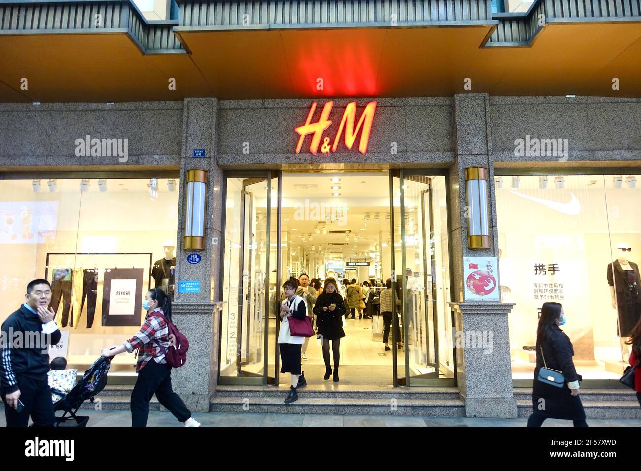 CHENGDU, CHINA - MARCH 24, 2021 - People walk past the H&M Chengdu ...