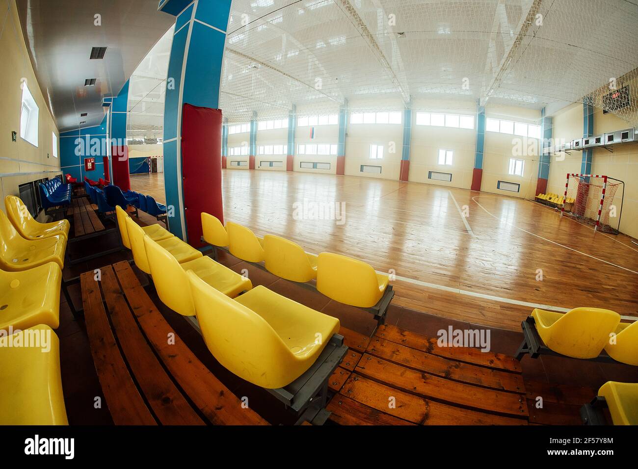 colored stands for fans in an indoor stadium. seats in the sports hall ...
