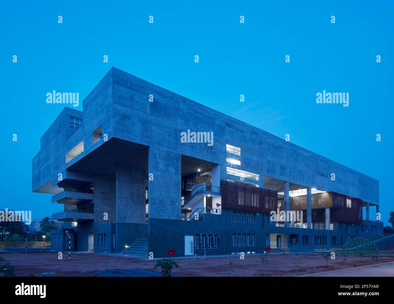 Exterior facade view at dusk. Vijayawada School of Planning And ...