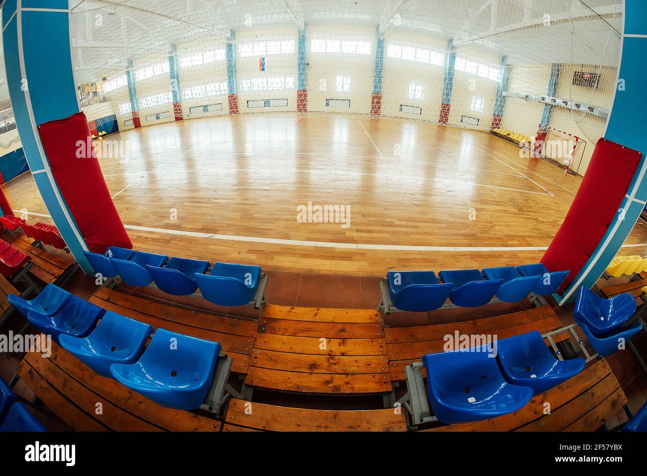 colored stands for fans in an indoor stadium. seats in the sports hall ...
