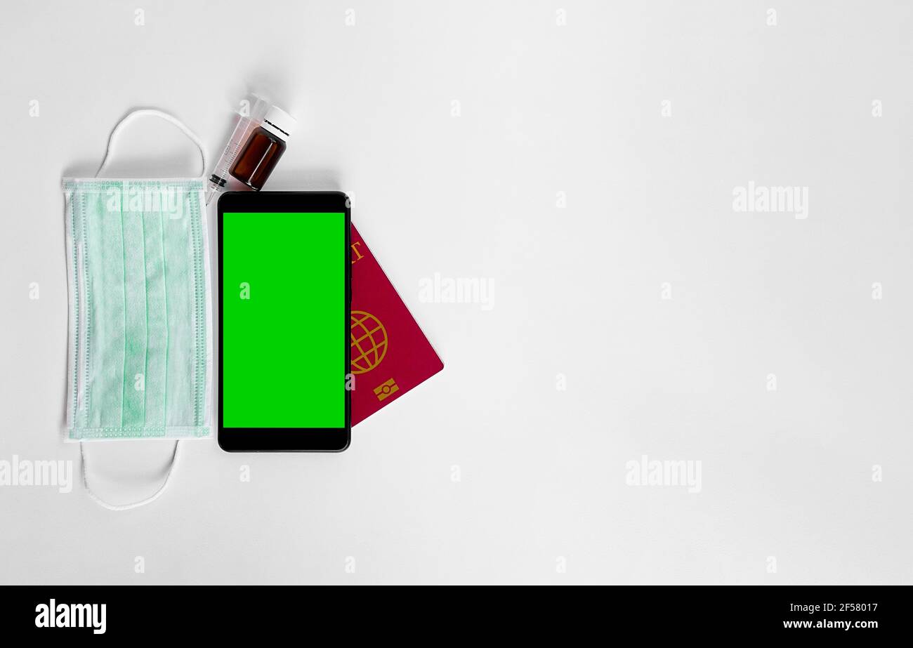 Passport and smart phone with green screen. Travel concept with copy ...