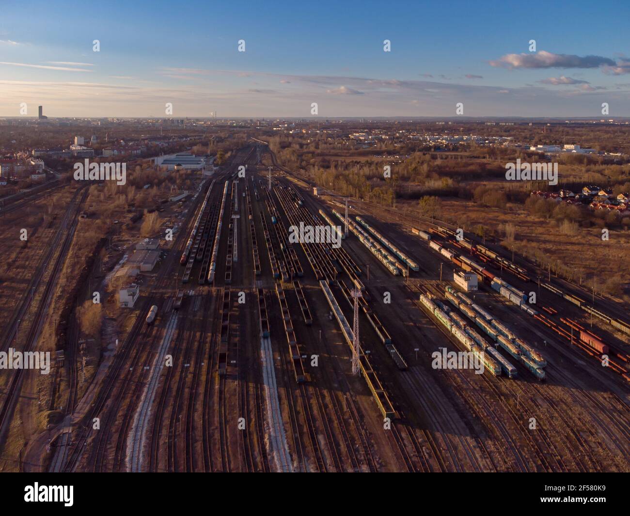 Drone shot over a railway sorting station with trains at sunset. Photo ...