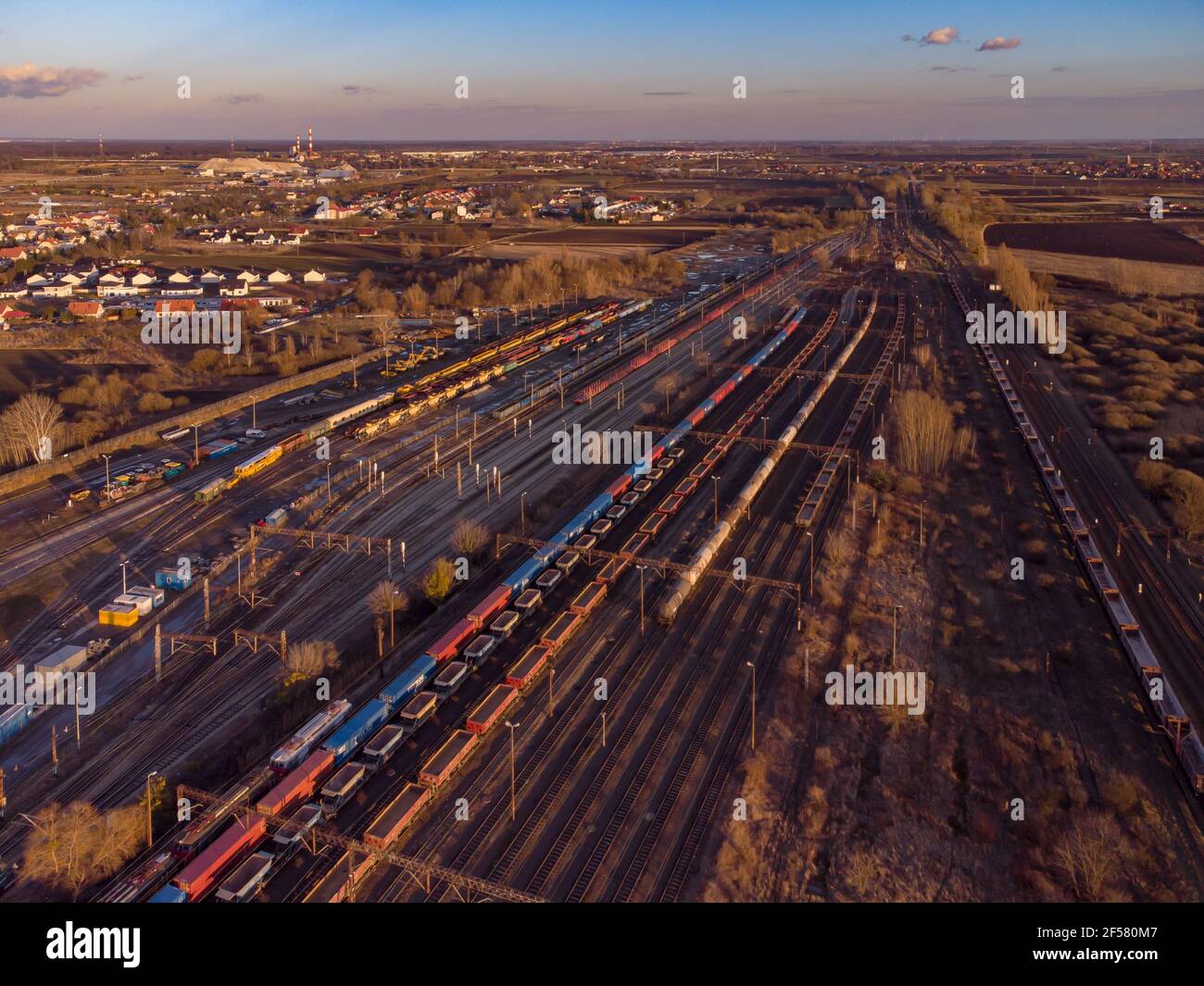 Drone shot over a railway sorting station with trains at sunset. Photo ...