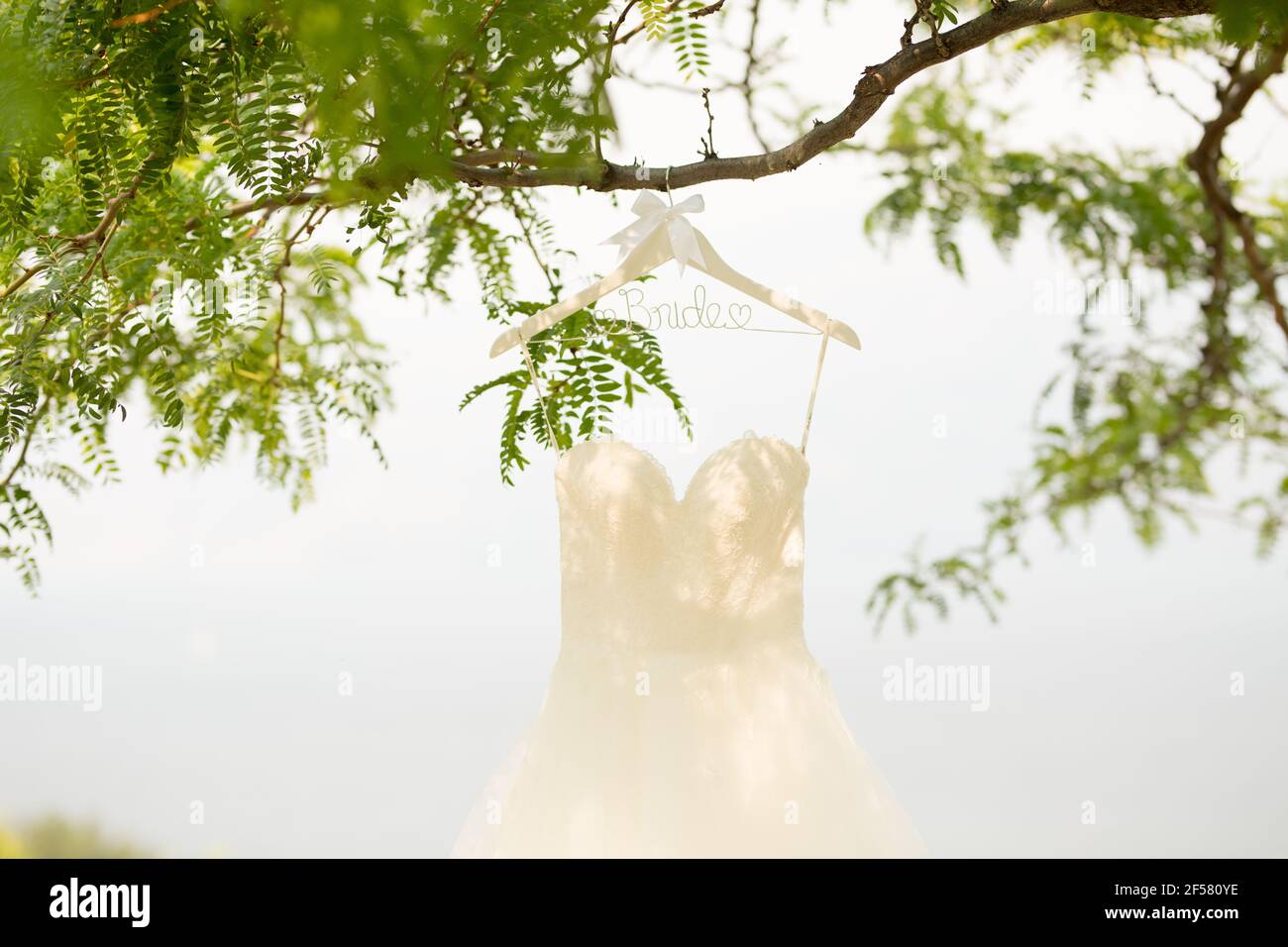 Hanging up a dress hi-res stock photography and images - Alamy