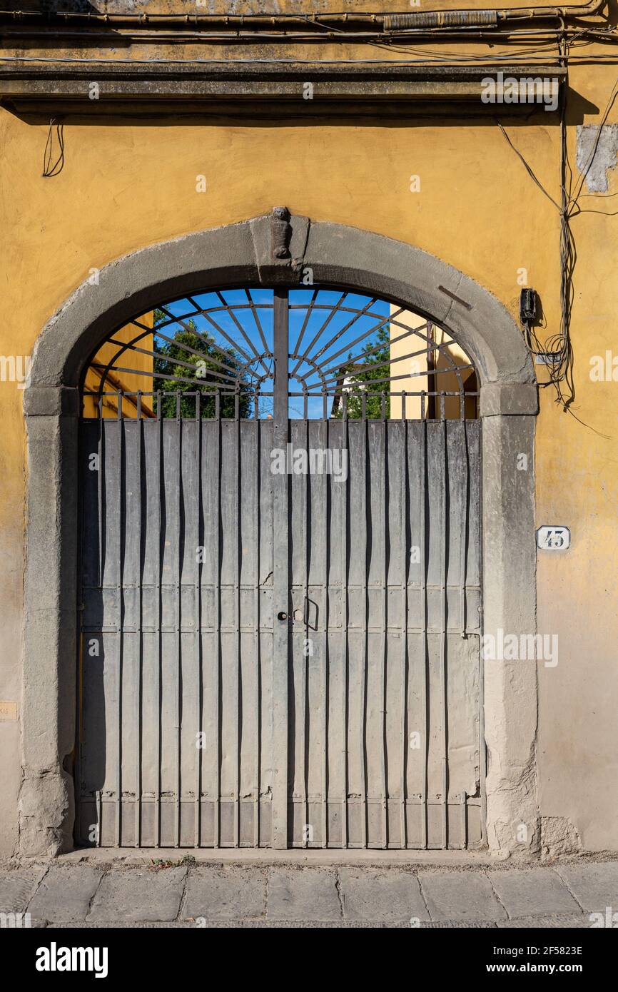 Closed Old Arched Metal Gate and Security Door in Florence, Italy Stock ...