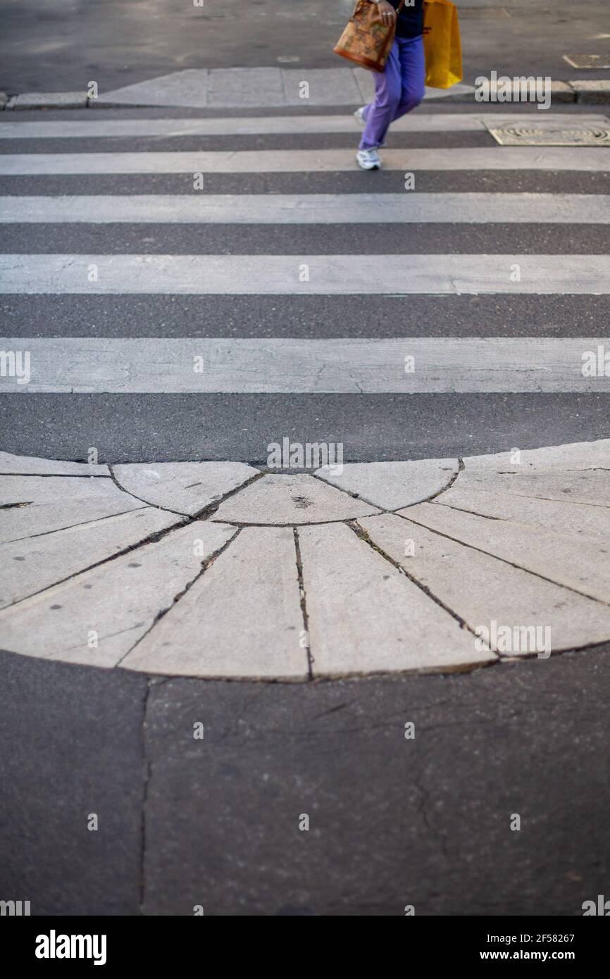 Colourful Woman Running Across A Pedestrian Crossing Stock Photo - Alamy