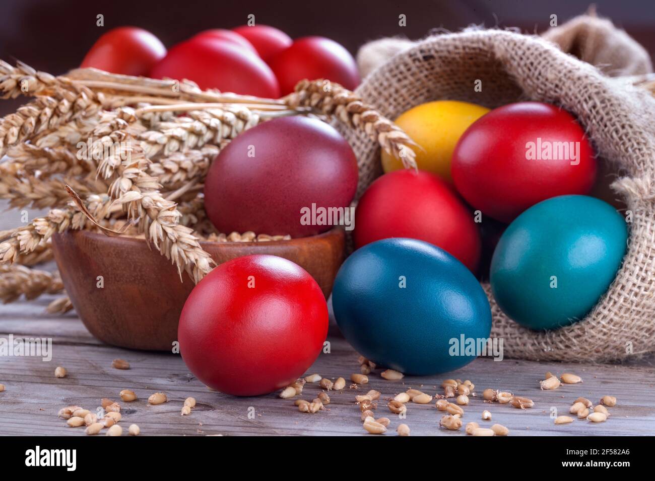 Painted eggs in a linen sack for the celebration of Easter Stock Photo ...