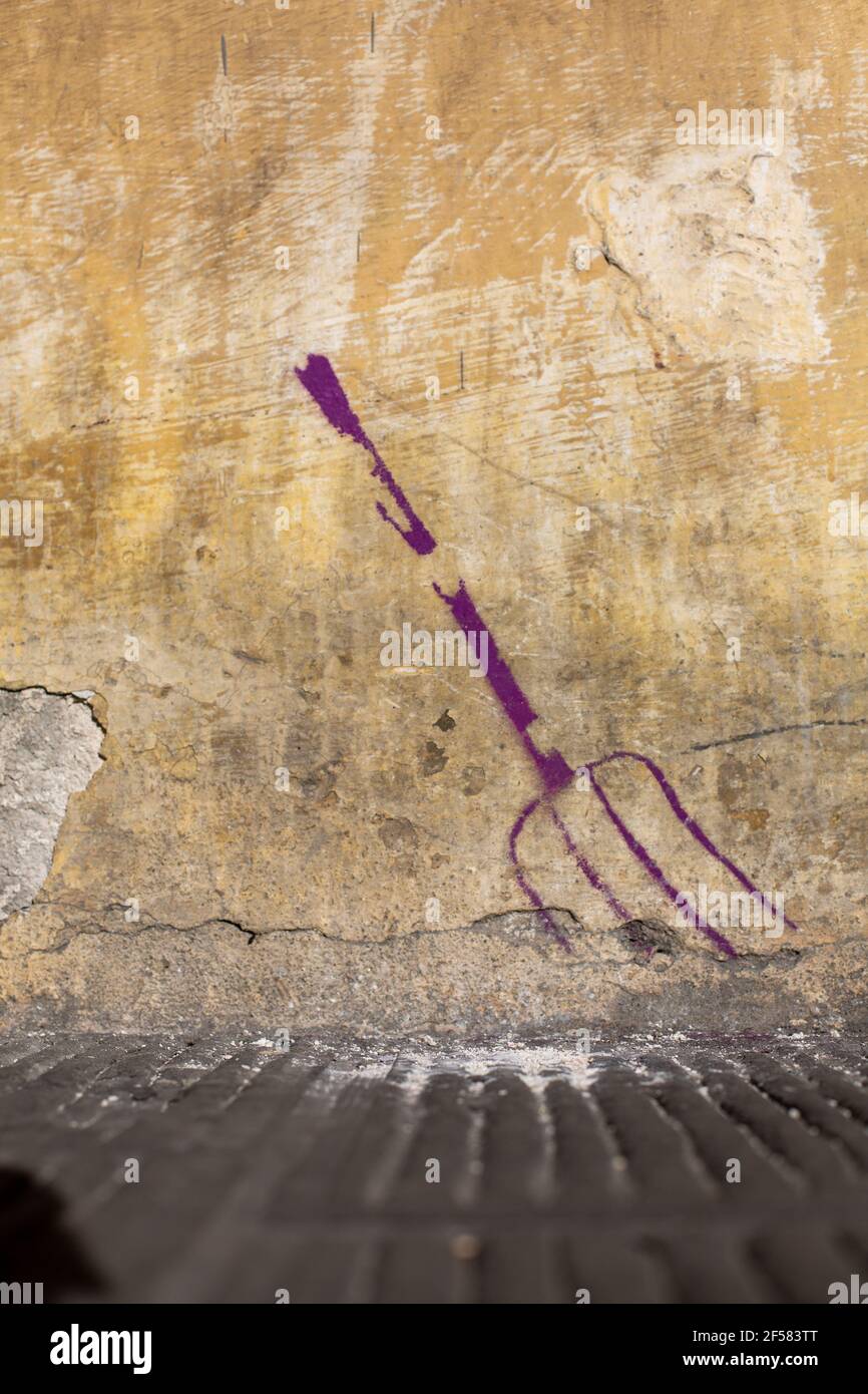 Pitch Fork Street Art On A Textured Wall And Pavement In Florence ...